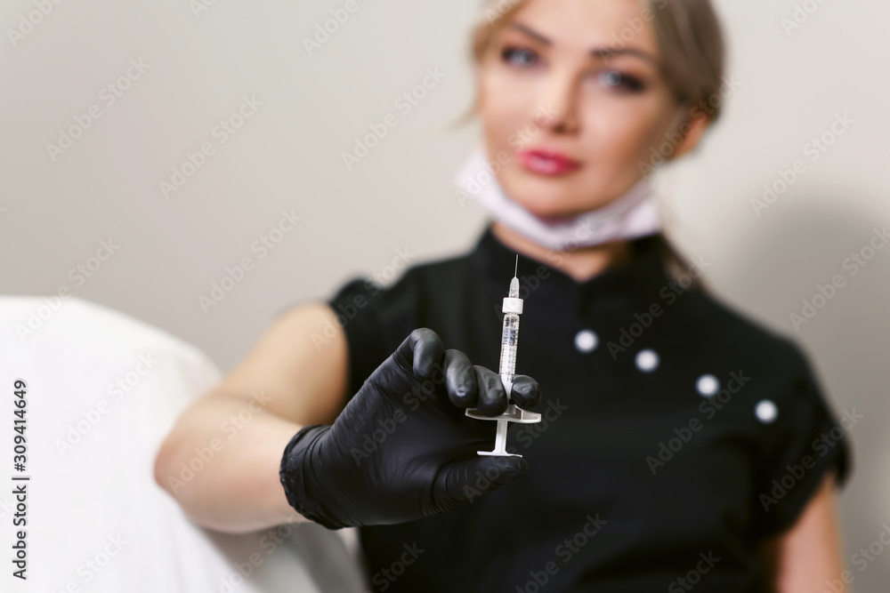 Portrait of beauty doctor. Beautiful young woman beautician in black ...
