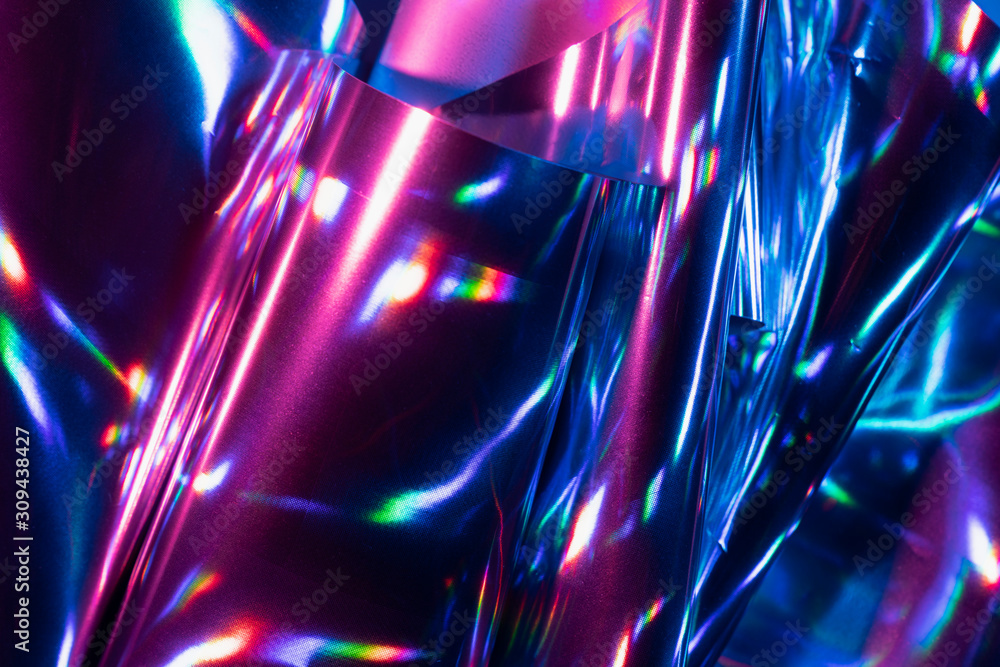 Reflection of light on holographic foils with neon lighting Stock Photo ...