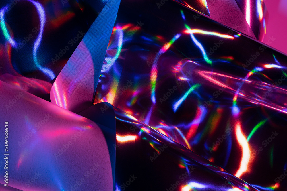 Reflection of light on holographic foils with neon lighting Stock Photo ...