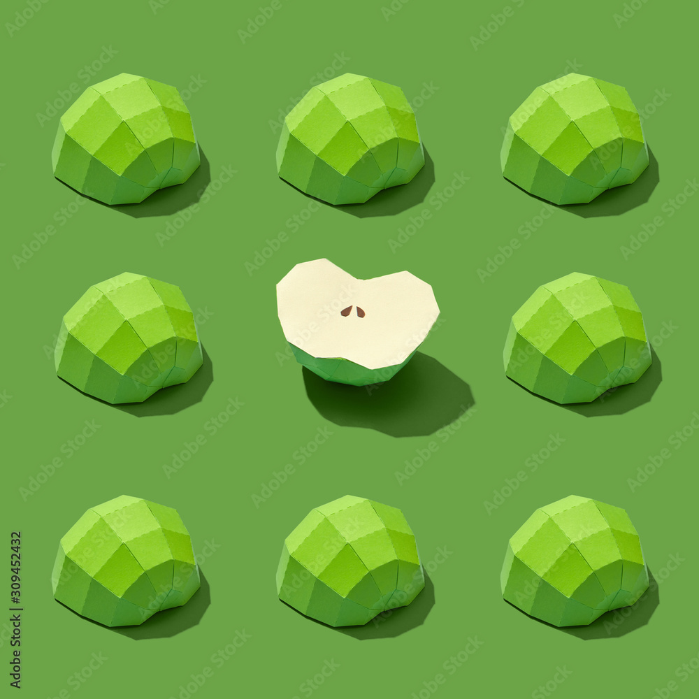 Handcraft paper apple halves on a green background . Beautiful food ...