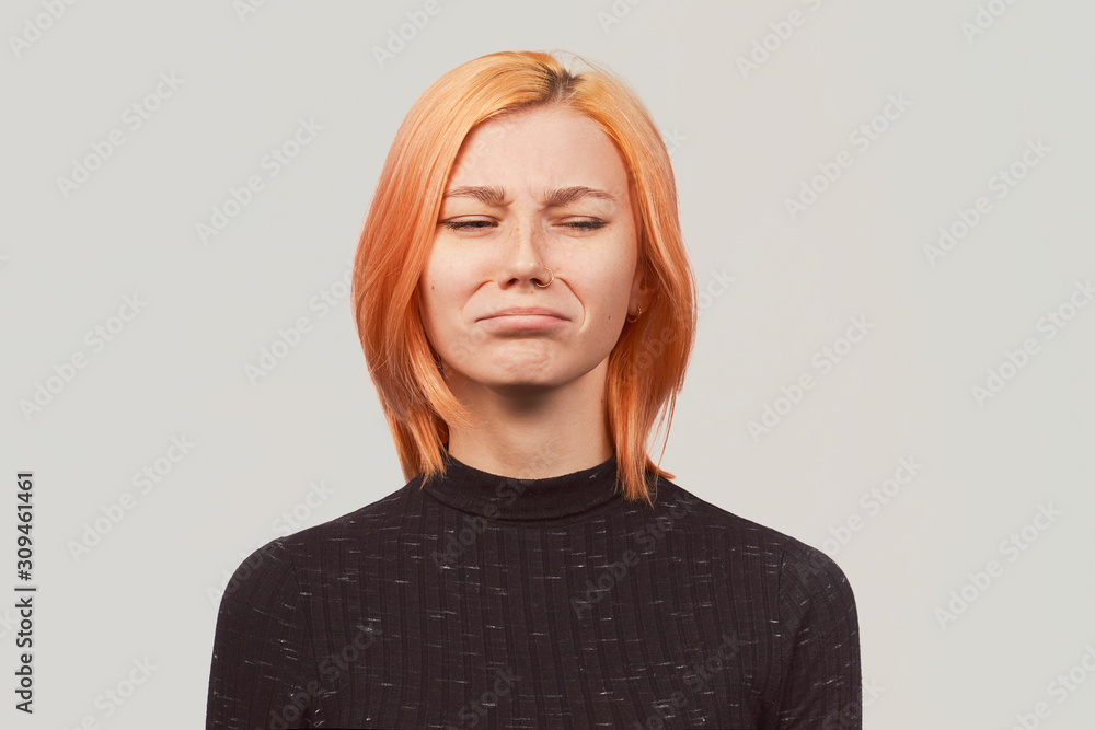 Worried woman closing her eyes cries in depression looking sick and ...