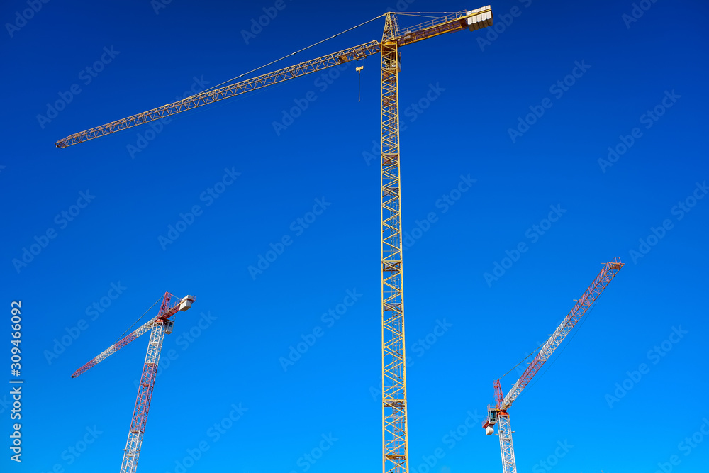 Building construction cranes in an area of redevelopment and ...