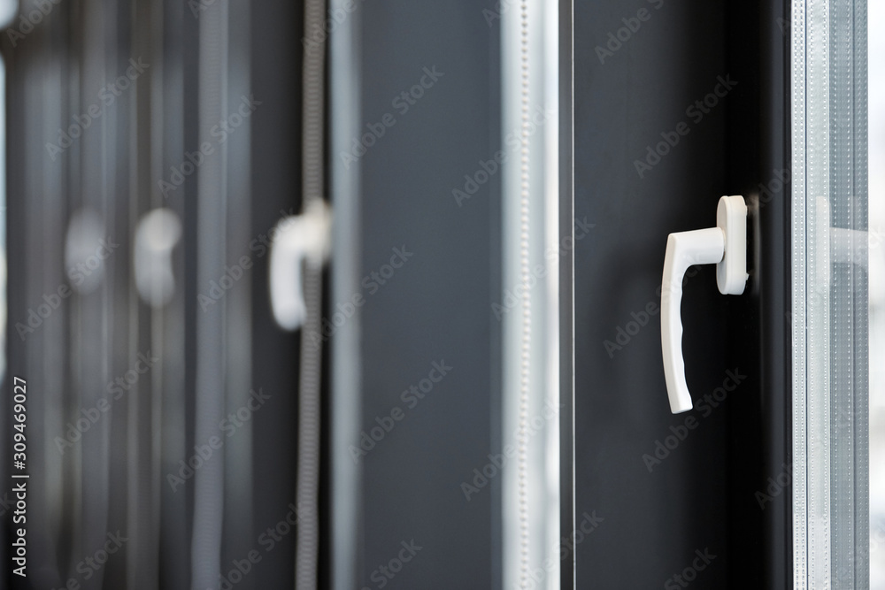 Windows row in office building. Modern windows with handles. Rows of ...