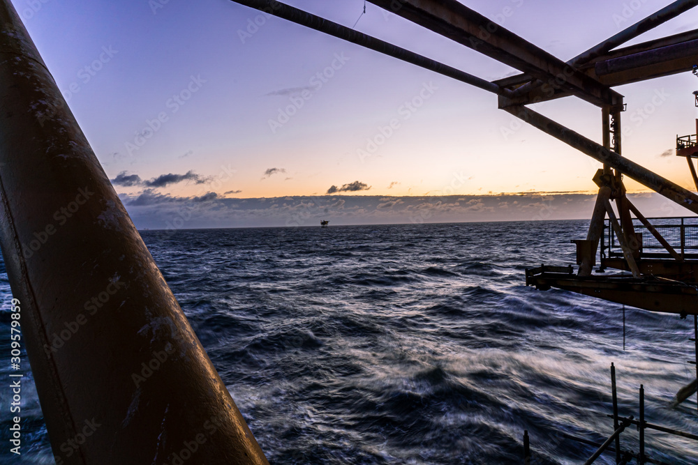 Sea and Offshore Sunrise on a Winter Morning with Oil Rig on the ...