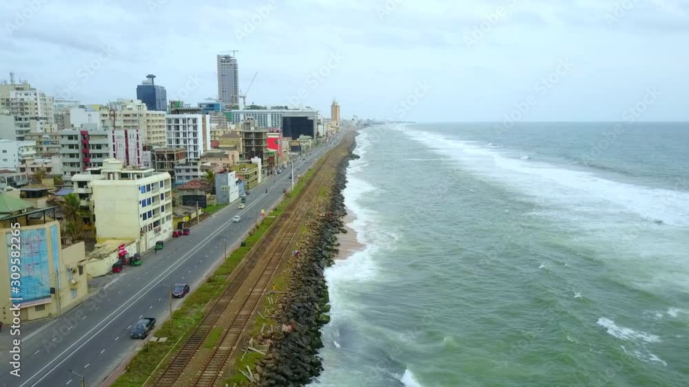 Aerial view of ocean wave reaching the coastline in Colombo, Sri Lanka ...