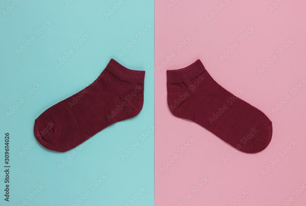 Red socks on pink blue background. Pastel color trend. Top view Stock ...