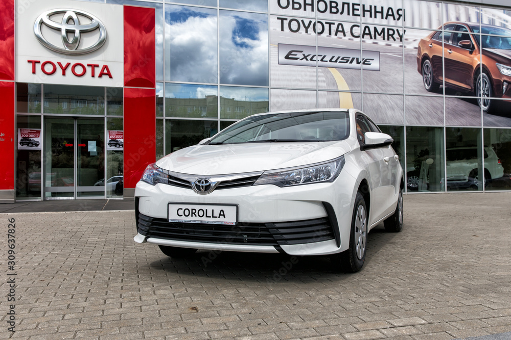 Toyota Corolla in front of the motor show Stock Photo | Adobe Stock