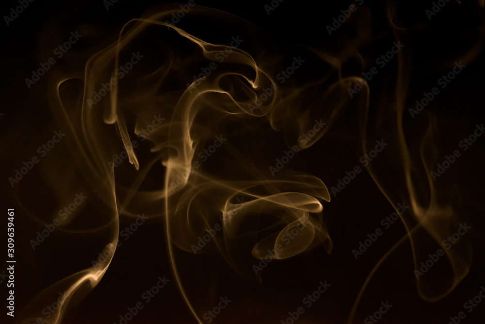 Gold smoke abstract on black background, fire design and darkness ...