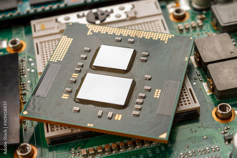 computer CPU close-up on the motherboard background, socket of central process unit, connection ...