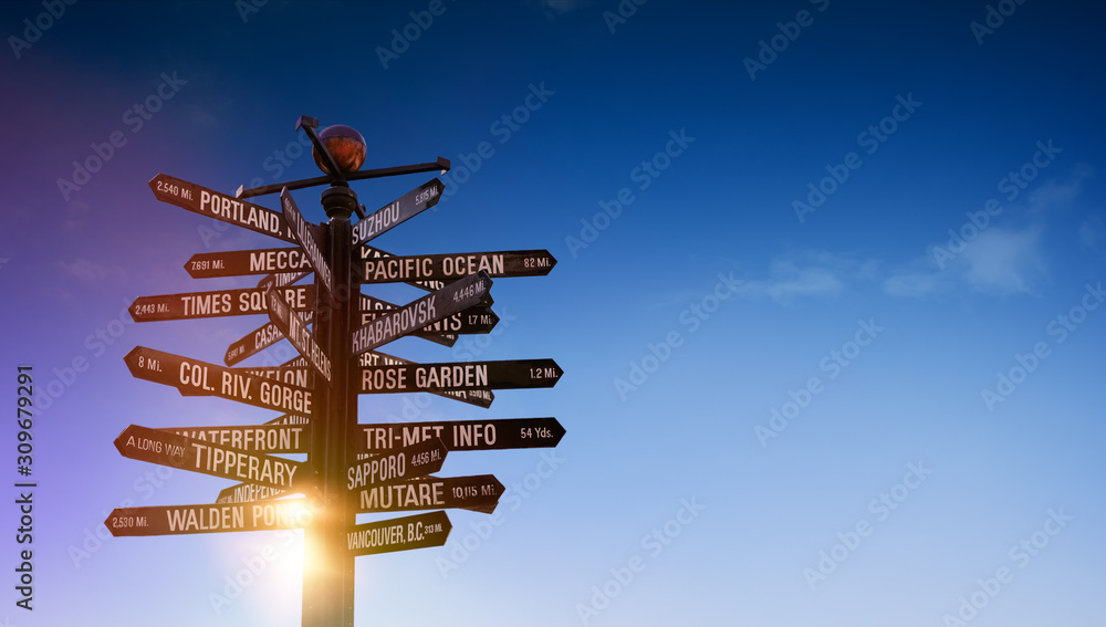 World Traffic signs and directional signpost pointing to famous travel ...