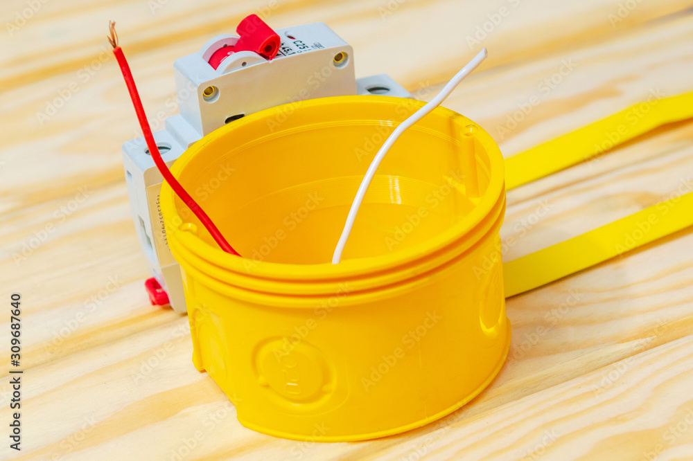 Electrical junction yellow box with cable wire used in the electric ...