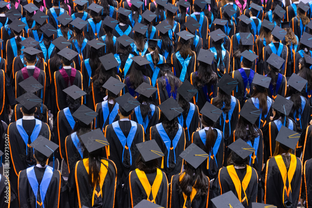 Rear view and soft selective focus of the graduates in the graduation ...