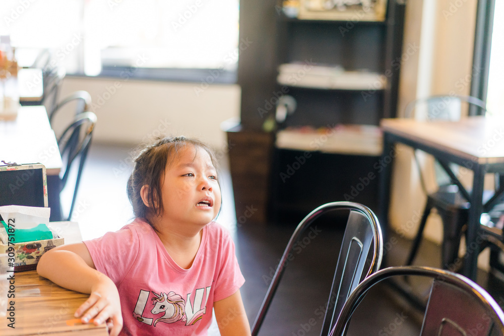 Angry, hungry,Crying little asian girl screaming in restaurant.Cry kid ...