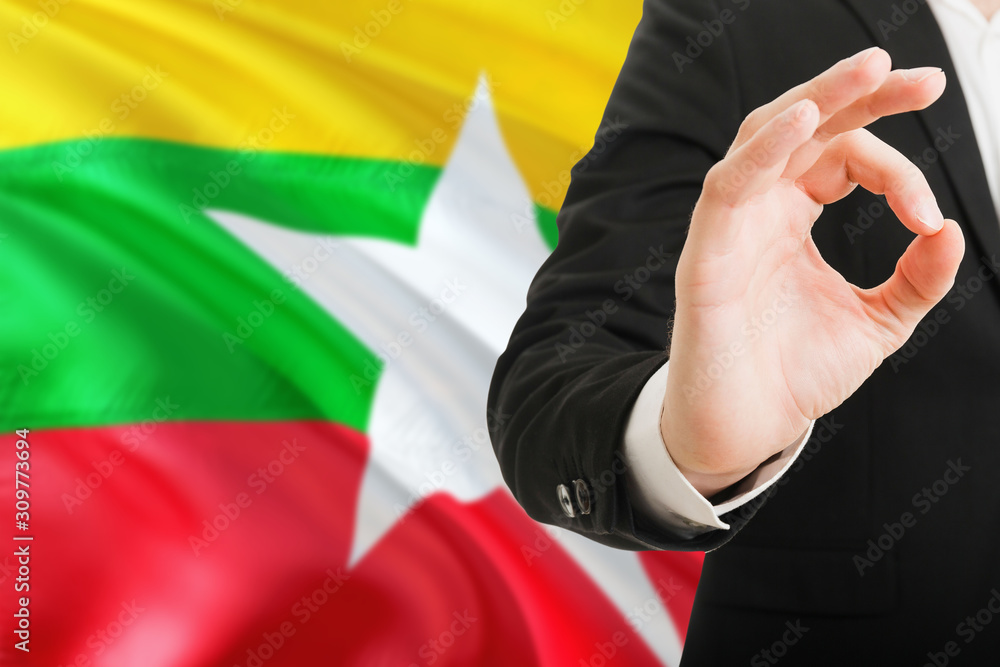 Myanmar acceptance concept. Elegant businessman is showing ok sign with ...