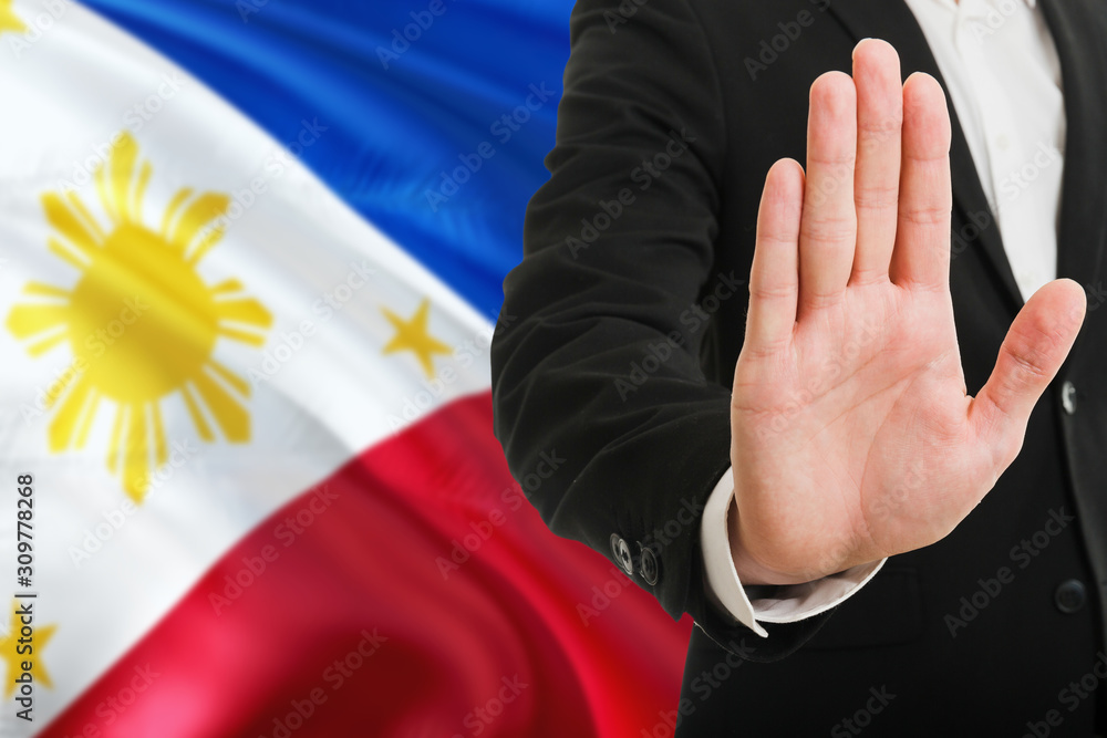 Philippines rejection concept. Elegant businessman is showing stop sign ...