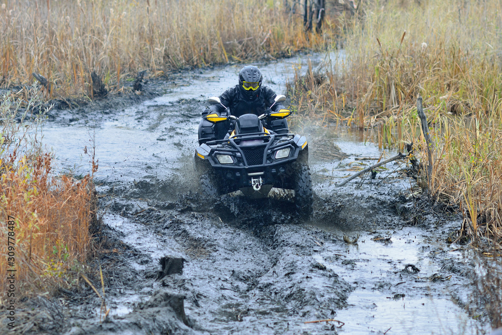 Cool pictures of active ATV driving in mud and water at Autumn weather ...