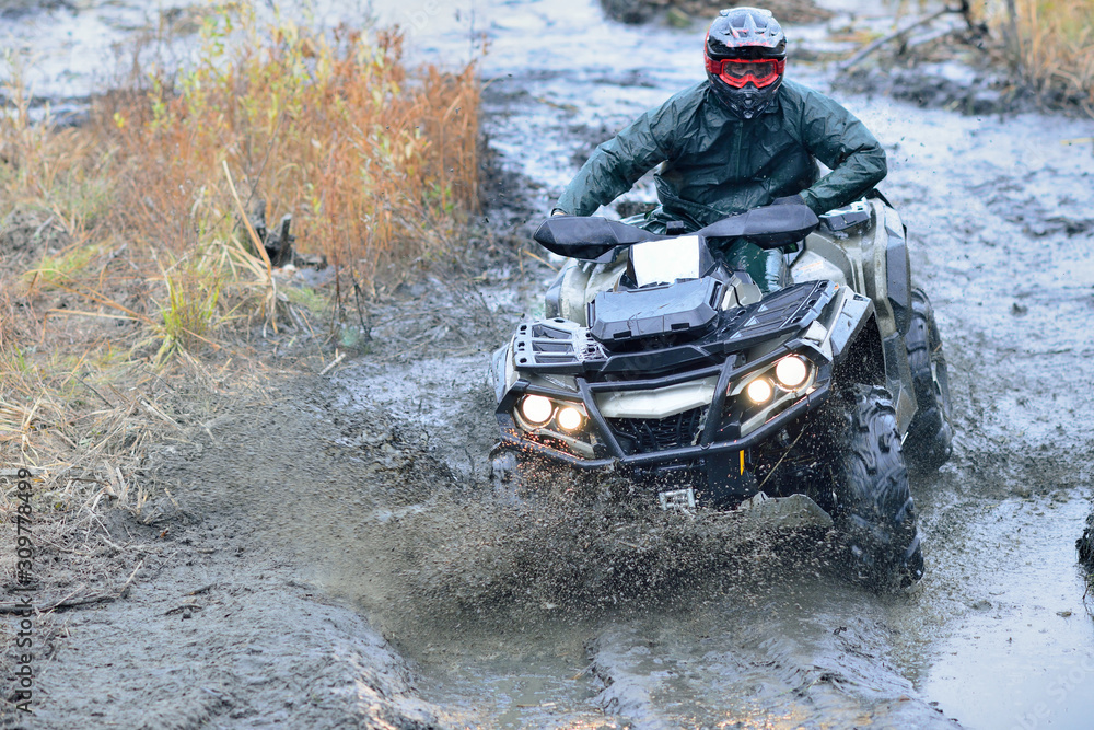 Cool pictures of active ATV driving in mud and water at Autumn weather ...