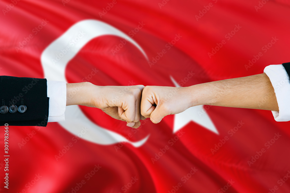 Turkey agreement concept. Man and woman fist bumping on national flag ...