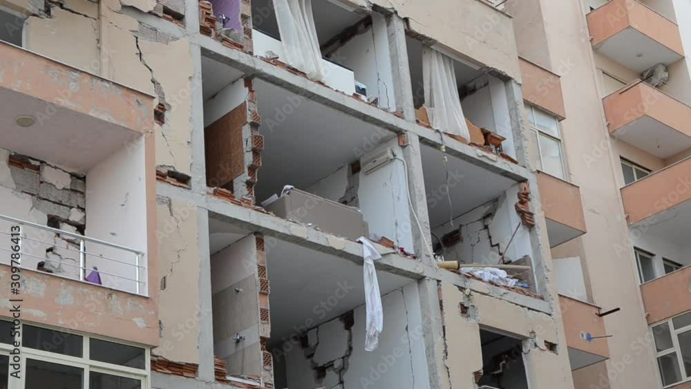 Room sections in the half-destroyed building after earthquake, closeup ...