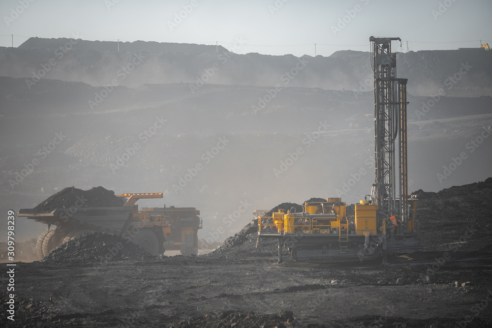 Open mine coal and minerals from bowels soil explosion. Drilling rigs ...