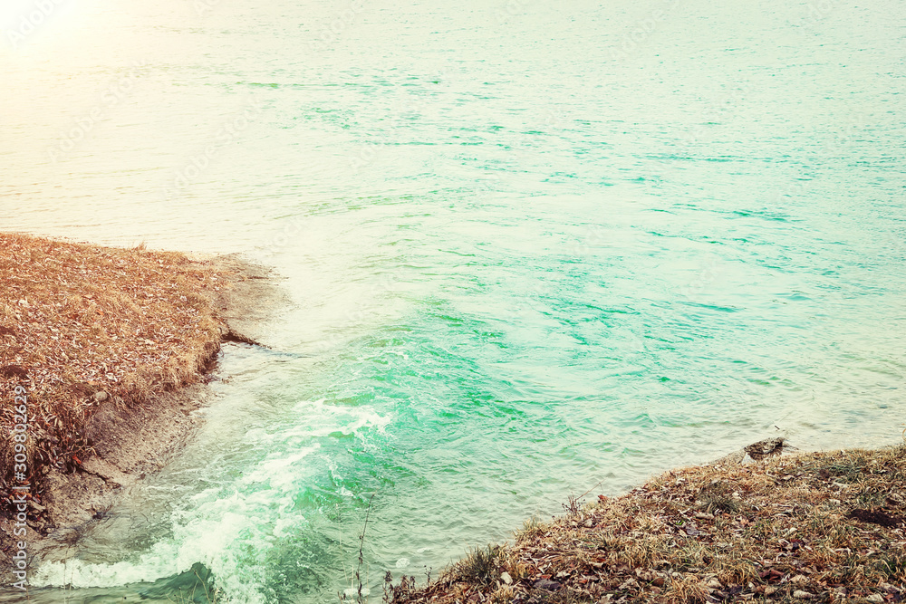 Poisonous, toxic waste flow into the reservoir lake sea ocean. Water ...