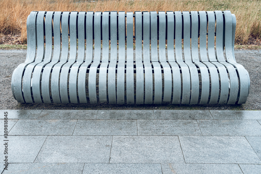 Modern metal bench in the park. Design of urban public space. The ...