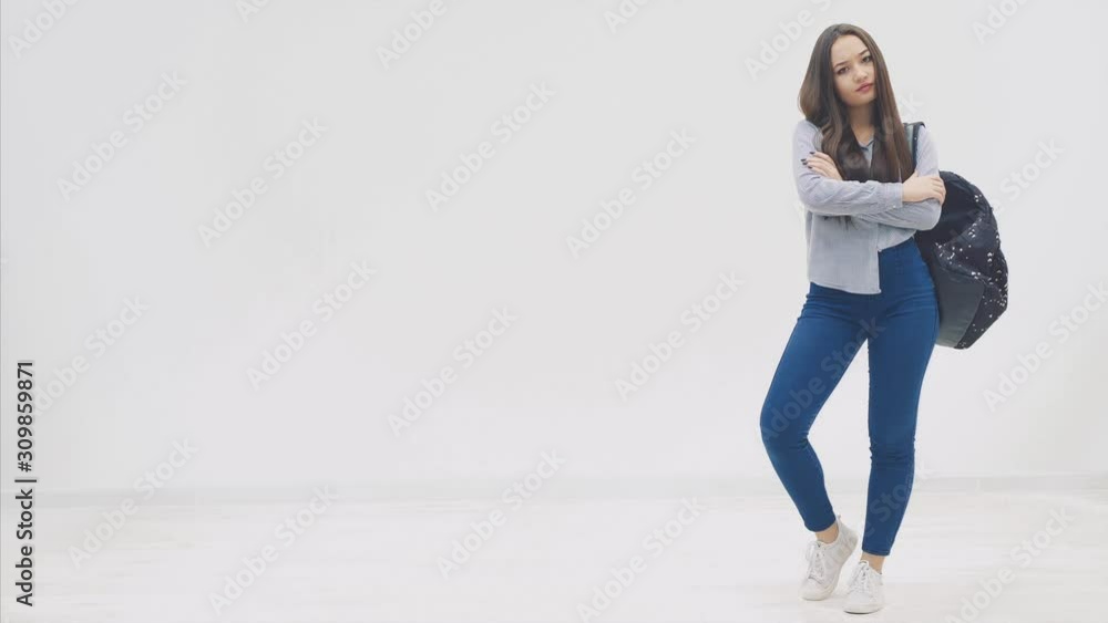 Full height asian, girl with long hair appearing on a white background ...