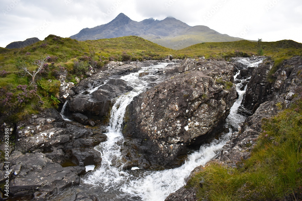 Two highland streams by the footpath with spectacular views. Red and ...