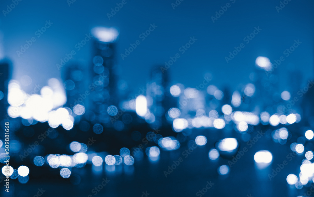 Bokeh background of skyscraper buildings in downtown. Urban city with ...