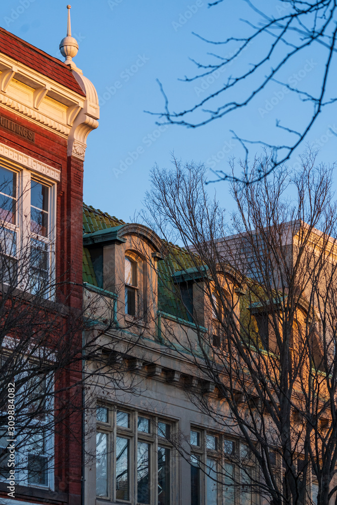 Renovated traditional American brick buildings with shops along a busy ...