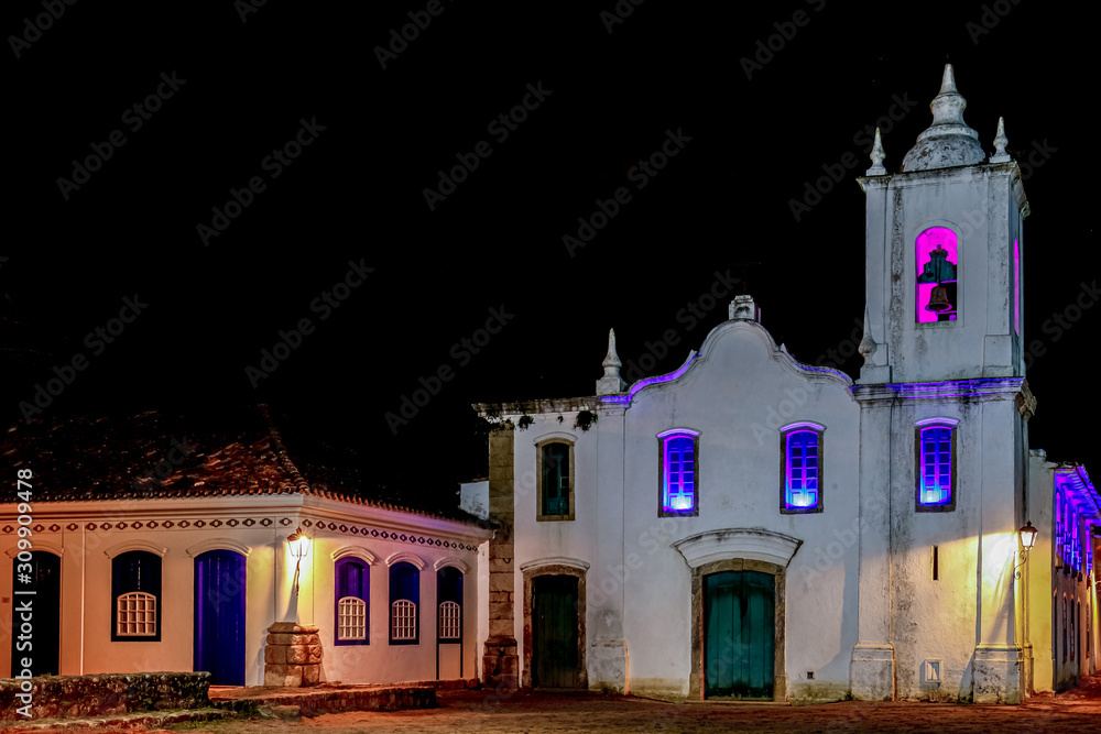 Atmospheric night view of illuminated church Nossa Senhora das Dores ...