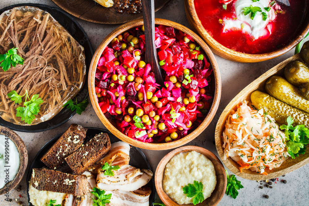 Traditional Russian cuisine concept. Borsch, jellied meat, lard, crepes ...