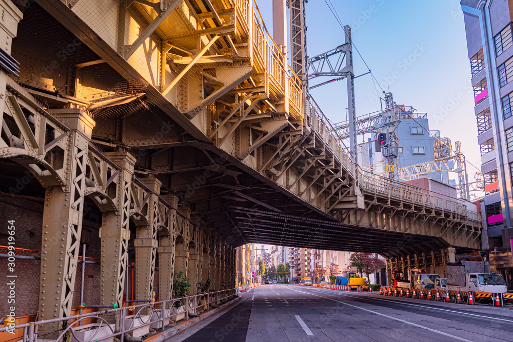 Japan. Tokyo. Railway bridge runs from above the road. Panorama of ...