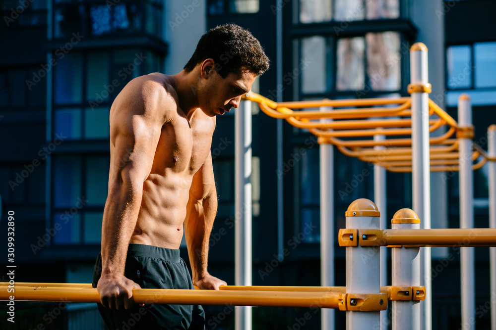 Portrait of athlete young mixed race man resting after exercises on ...