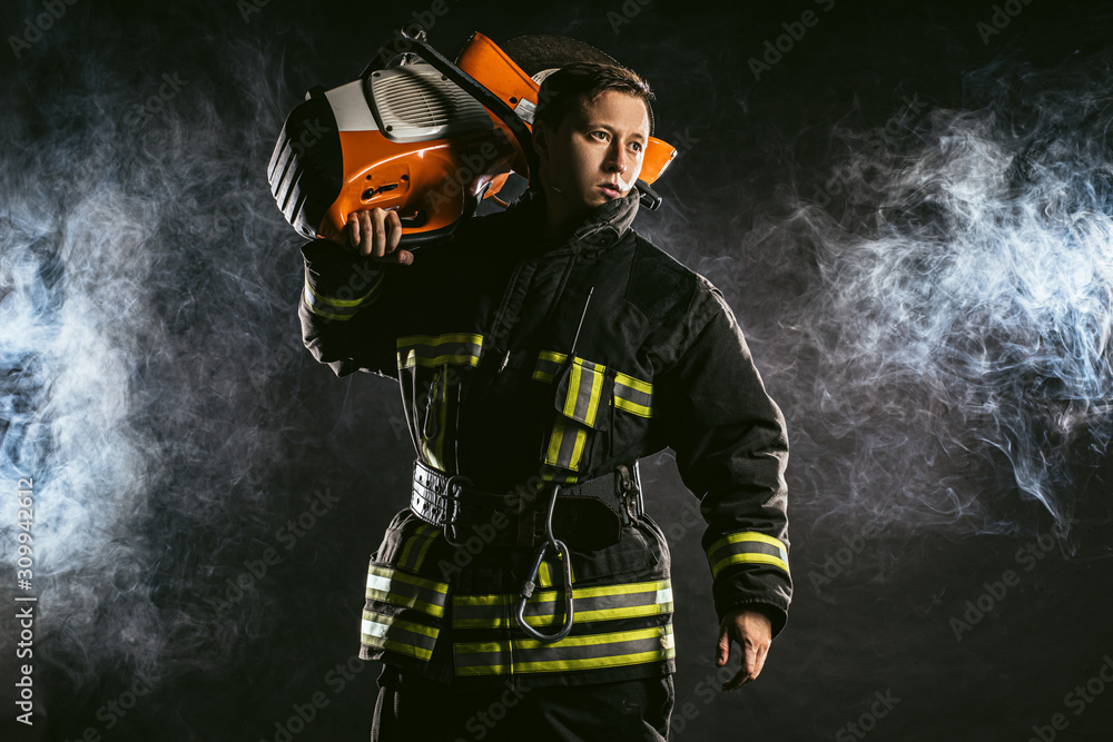 brave man fire fighter extinguishing fire, work at fire station and ...