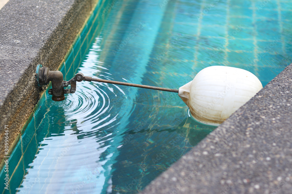 Float ball valve for filling water into the pool. Stock Photo | Adobe Stock