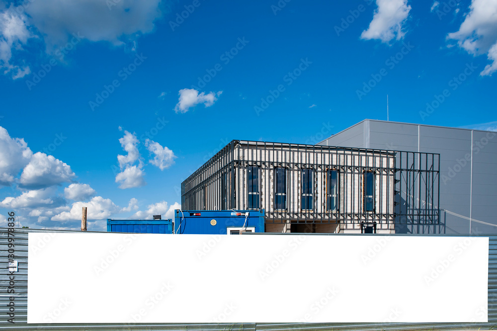 Blank white banner for advertisement on the fence of factory under ...