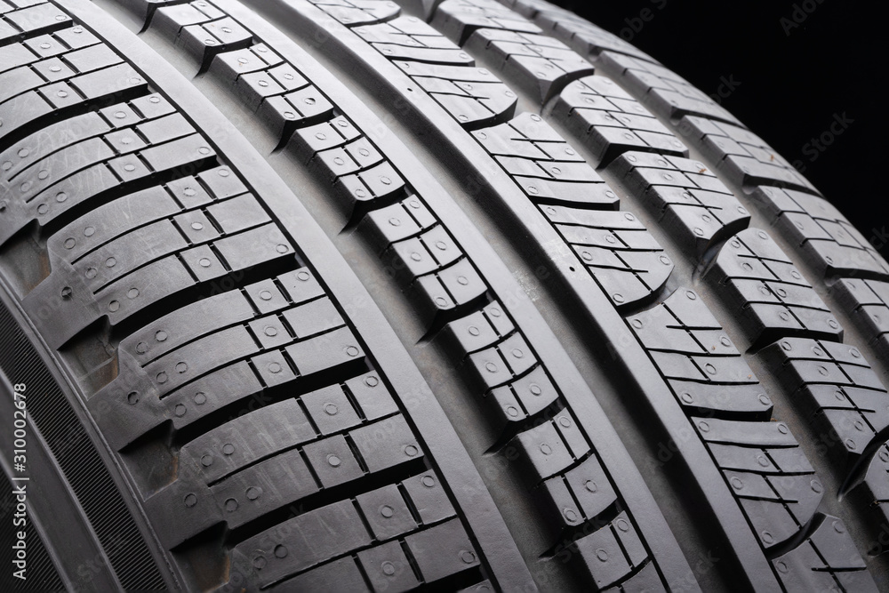 road tread protector all-season summer tire. close up. the tread blocks ...