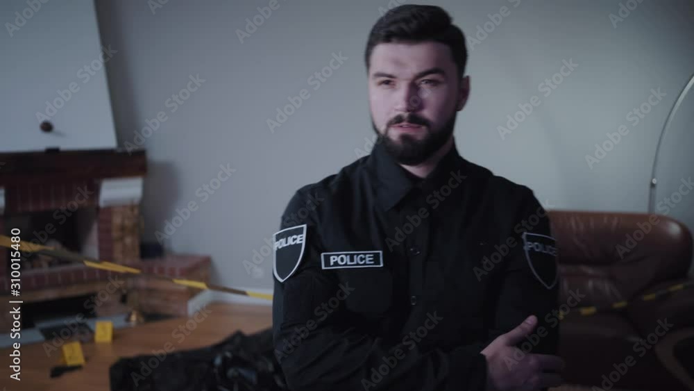 Vídeo do Stock: Portrait of handsome Caucasian bearded police officer ...