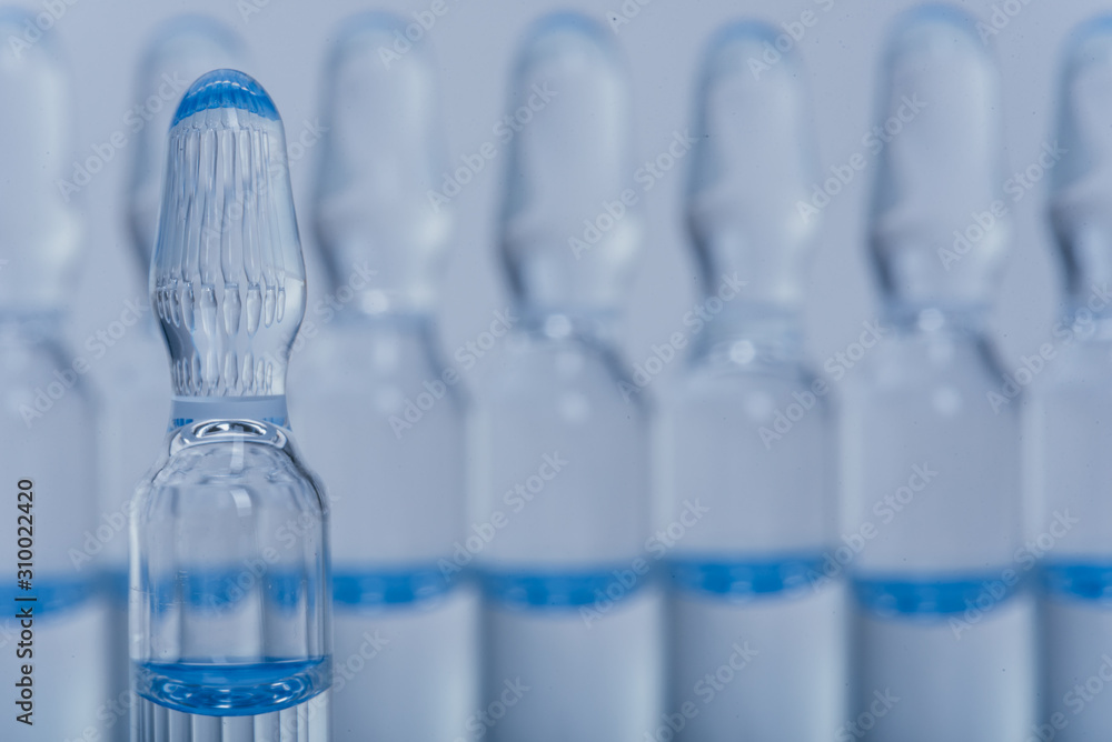 Glass medical ampoule vial for injection. Medicine is liquid sodium ...