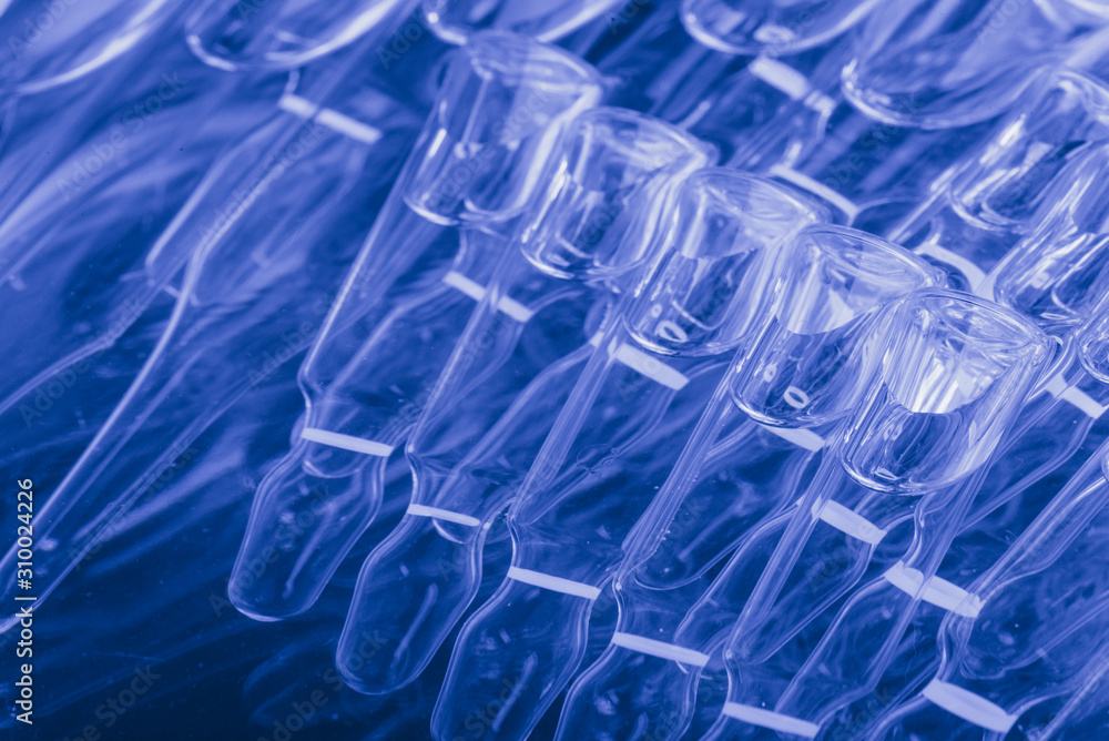 Glass medical ampoule vial for injection. Medicine is liquid sodium ...