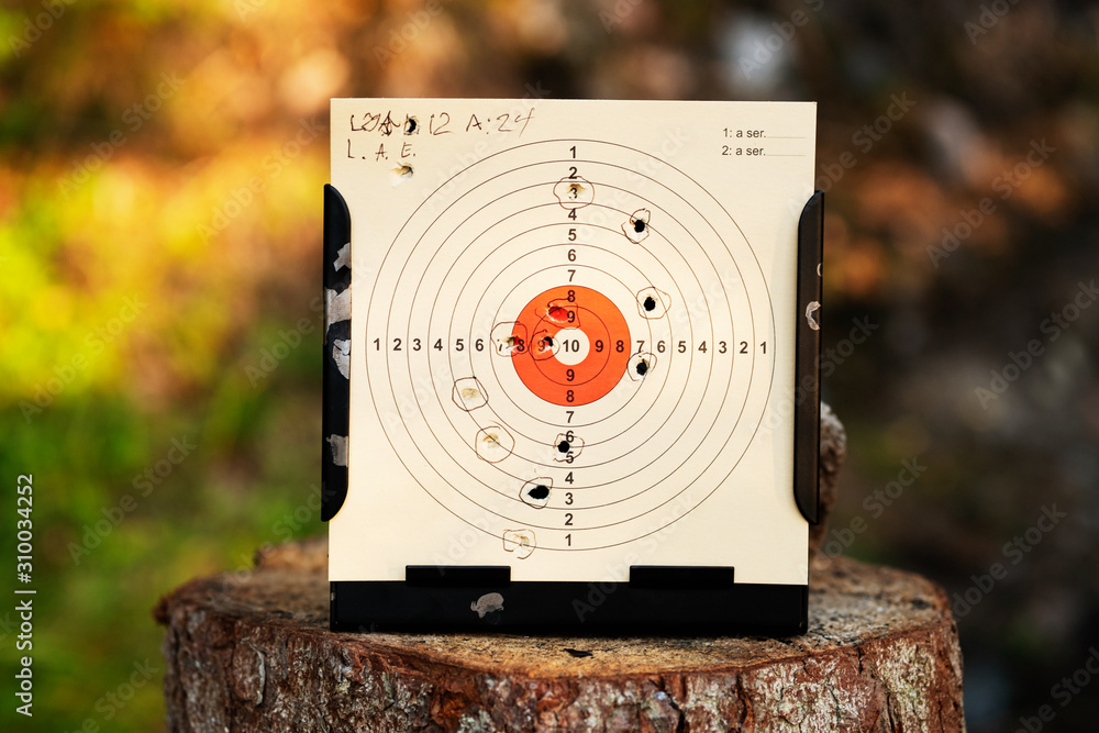 Bullet holes in shooting target Stock Photo | Adobe Stock