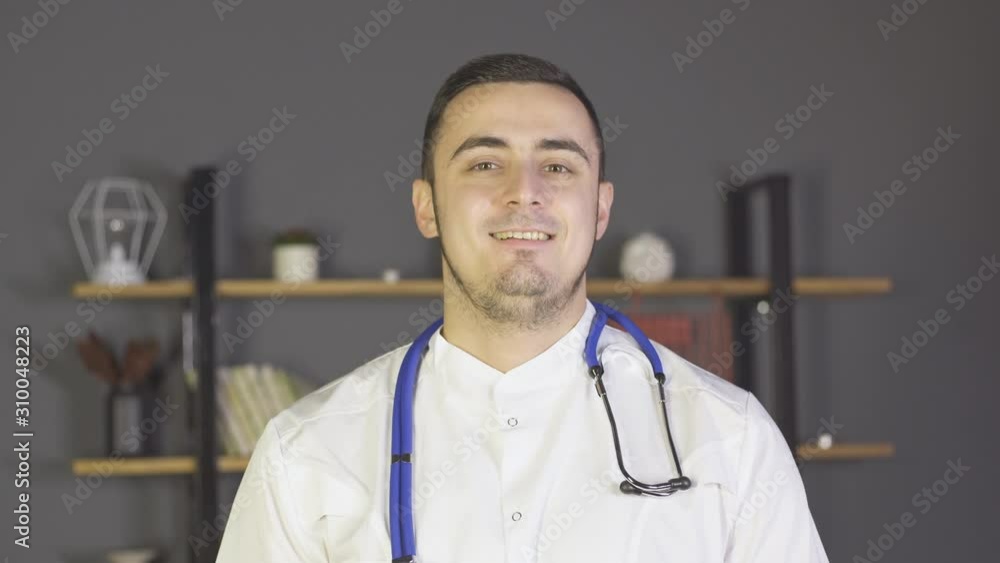 Smiling happy doctor giving a perfect ok gesture with his fingers ...