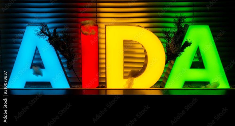 Illuminated Aida logo in a shop window in Limburg an der Lahn at ...