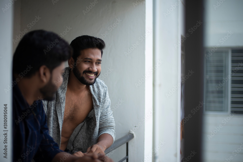 Two young tall, dark and handsome Indian Bengali men in western jackets ...
