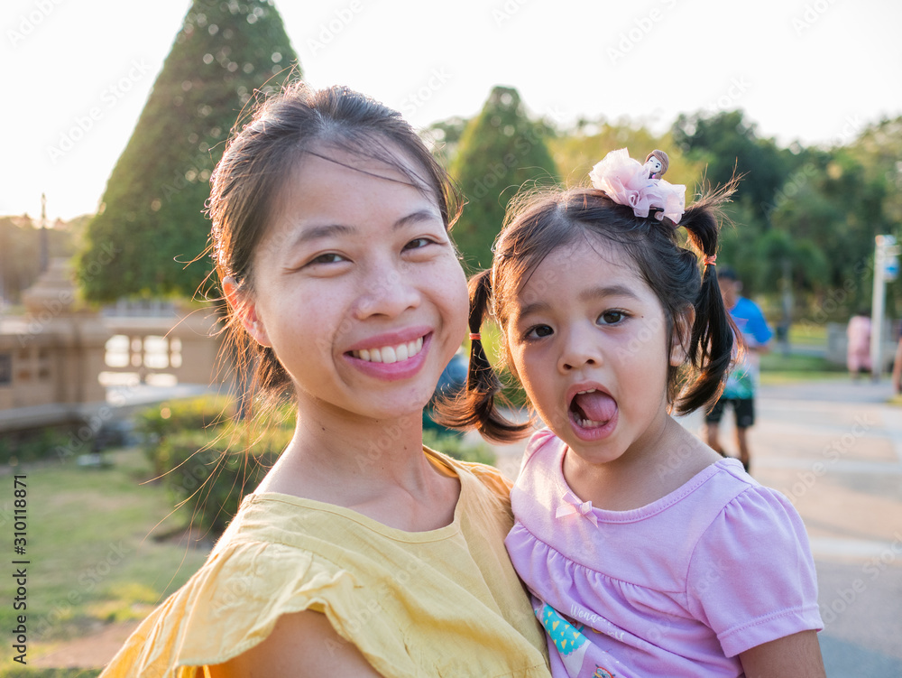 Portrait of Little Beautiful Asian Child Girl and Mother at Chaloem ...