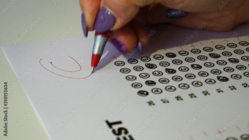 Young Hand of teacher using red pen write grade C+ (plus) and circle on ...