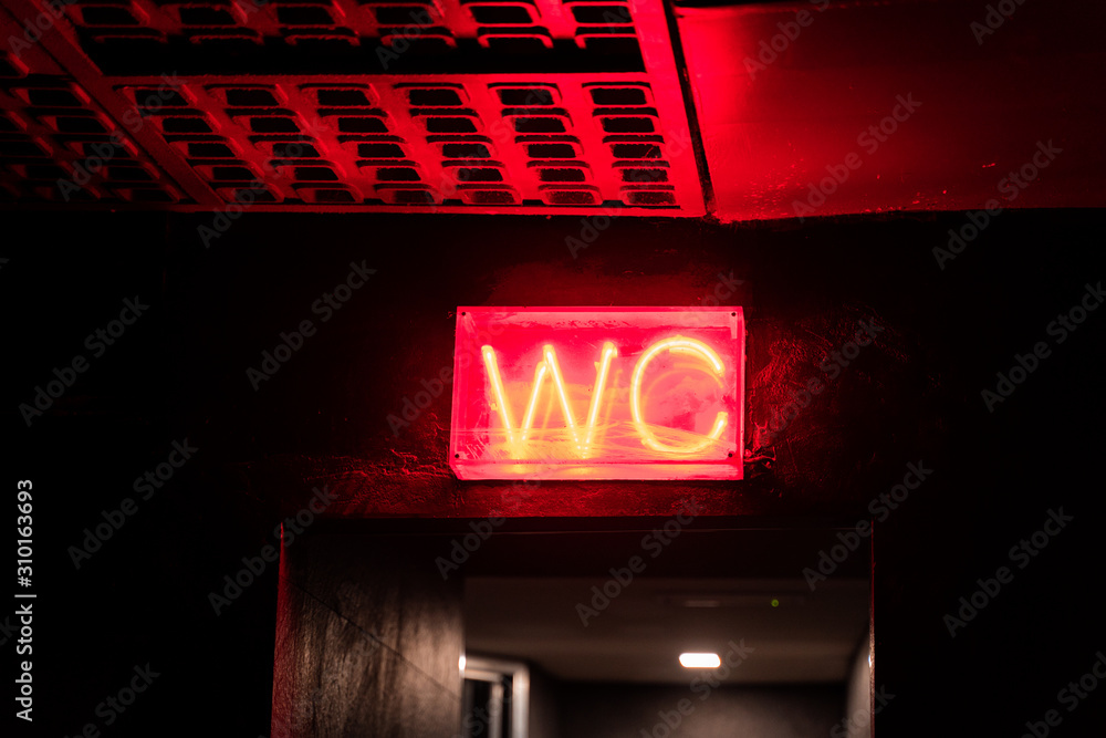 WC sign in a night club Stock Photo | Adobe Stock