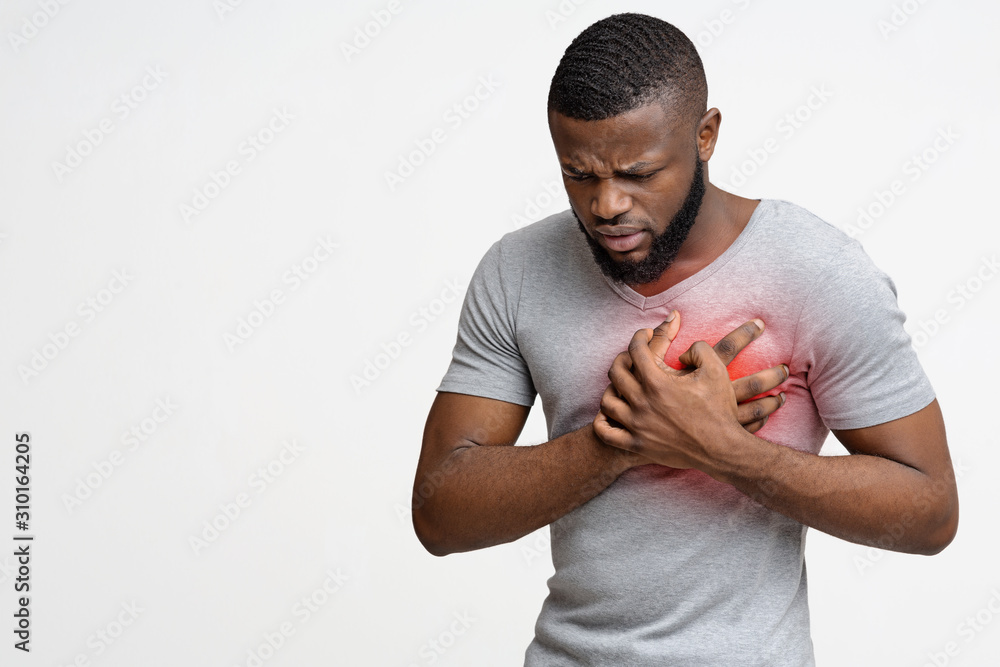Young black guy having heart attack, holding his chest Stock Photo ...