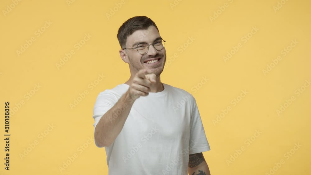 Energized and excited young man jumping from down, bottom side ...